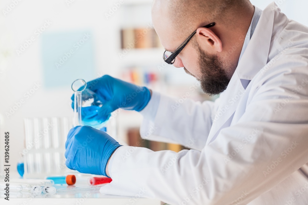 Man researcher carrying out scientific research. Stock Photo | Adobe Stock