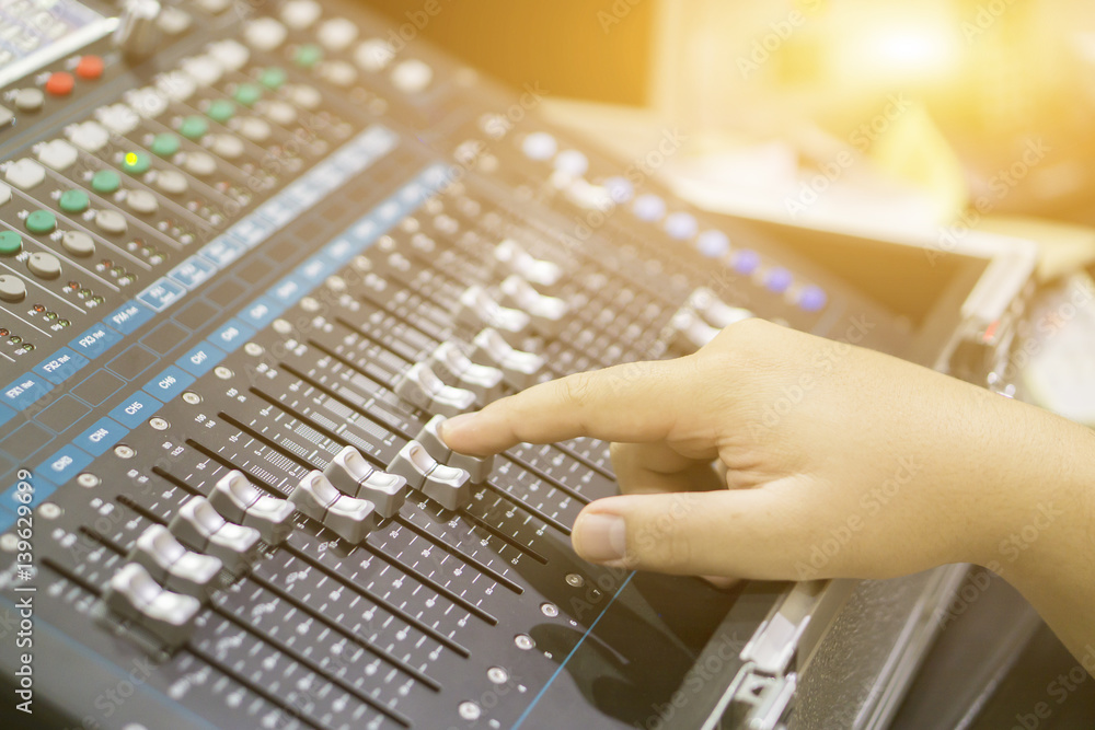 studio working with sound and light mixer console,hands of sound ...