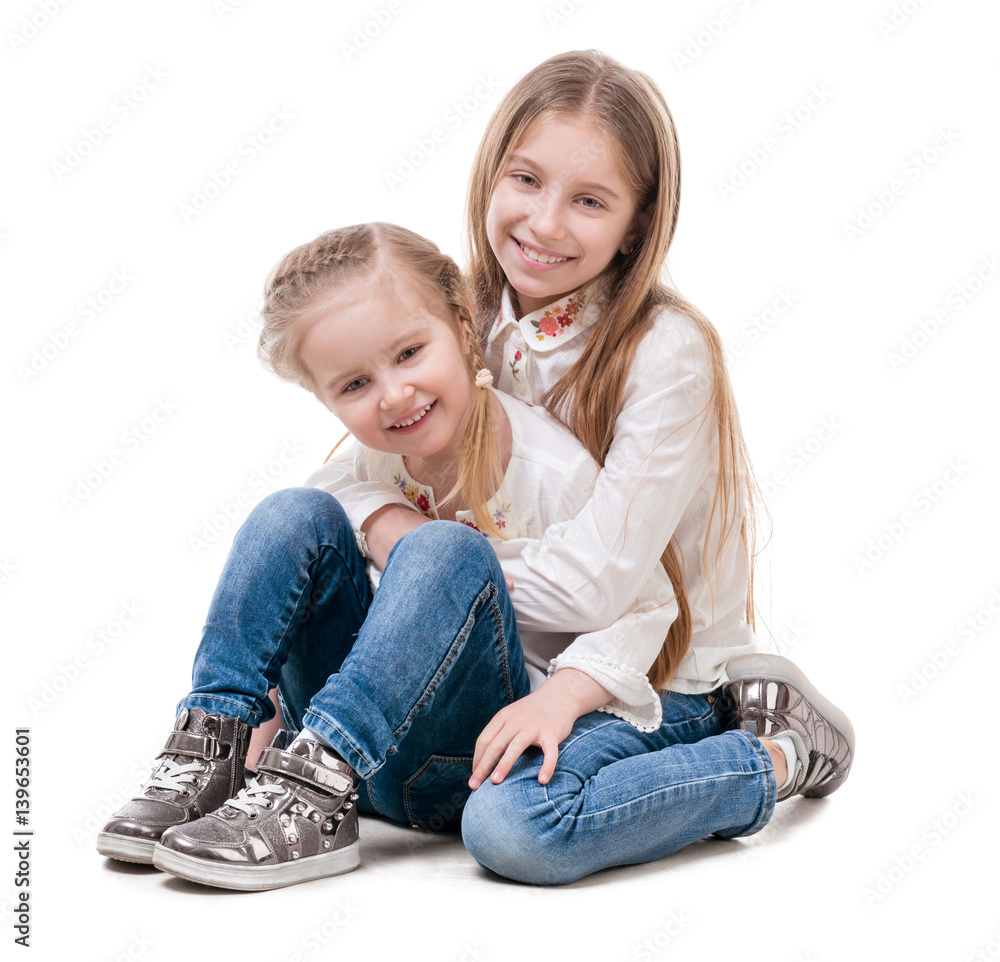 Two sisters holding each other, isolated Stock Photo | Adobe Stock