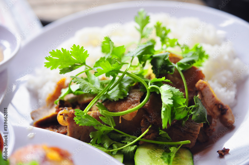 Vietnamese broken rice or com tam with fried chicken legs, pork and ...