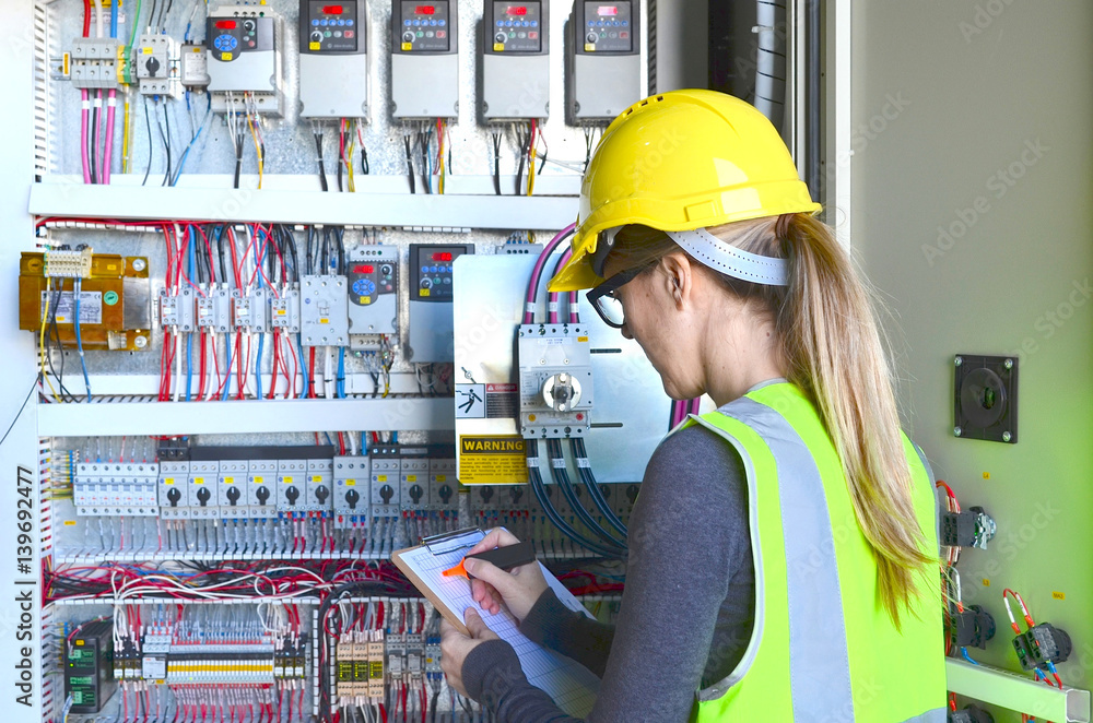 Female safety inspector investigating a factory work site Stock Photo ...