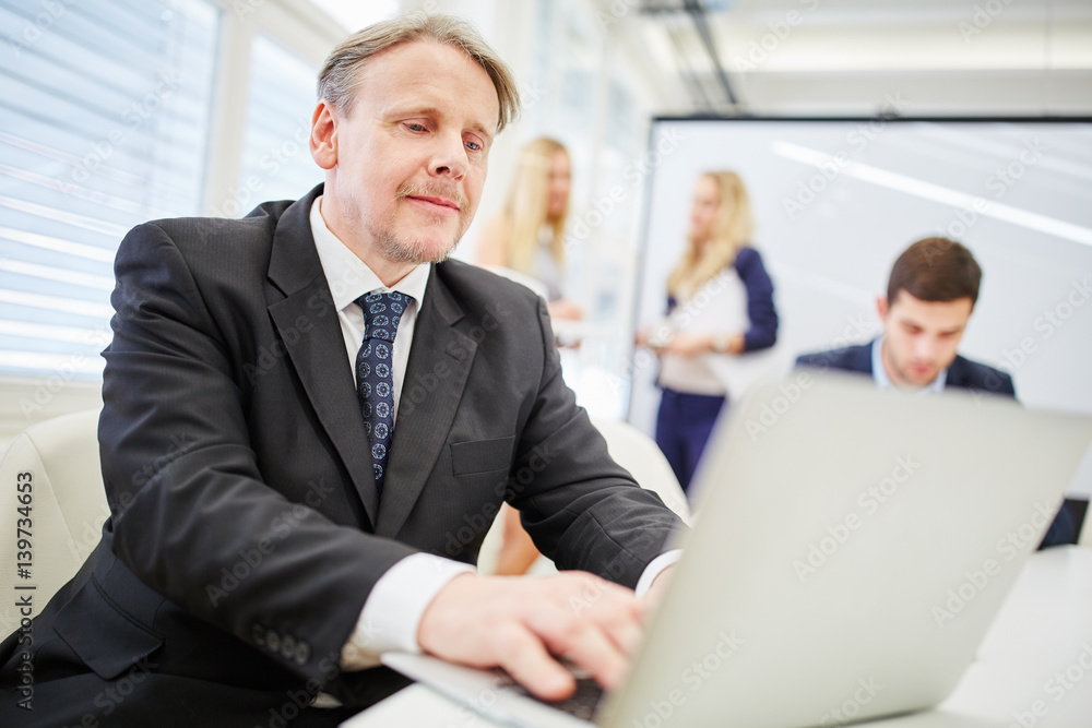 Man consultant with laptop Stock Photo | Adobe Stock