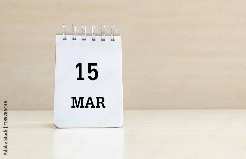 Closeup surface note book with black 15 mar word in page on blurred ...