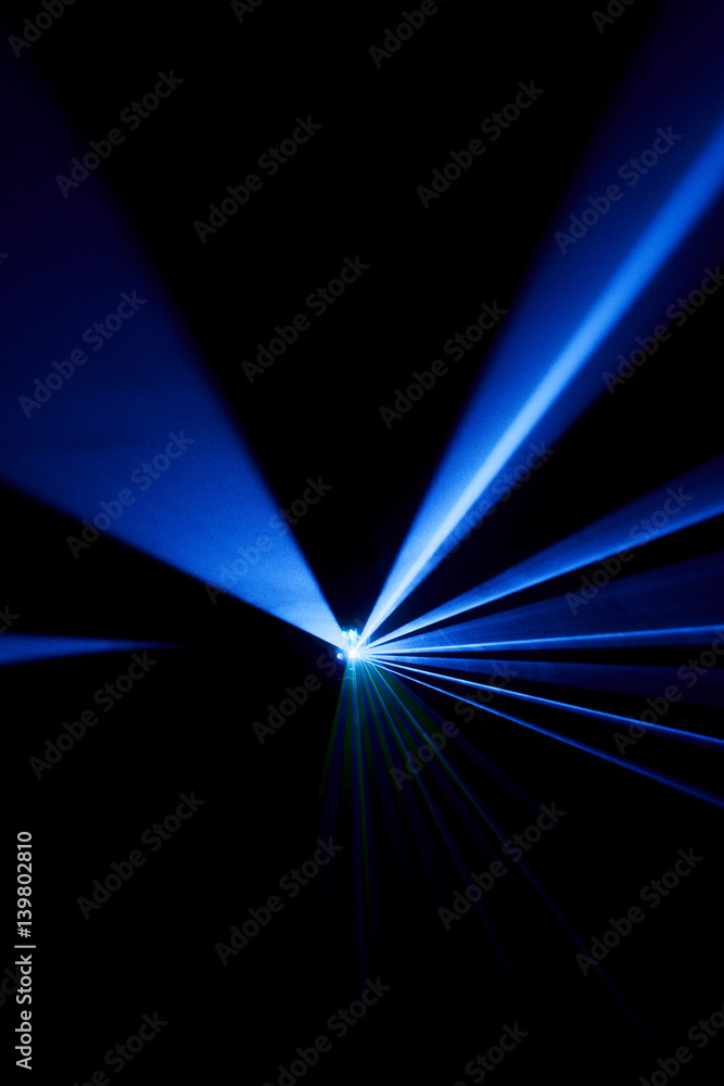 Laser beam blue on a black background Stock Photo | Adobe Stock