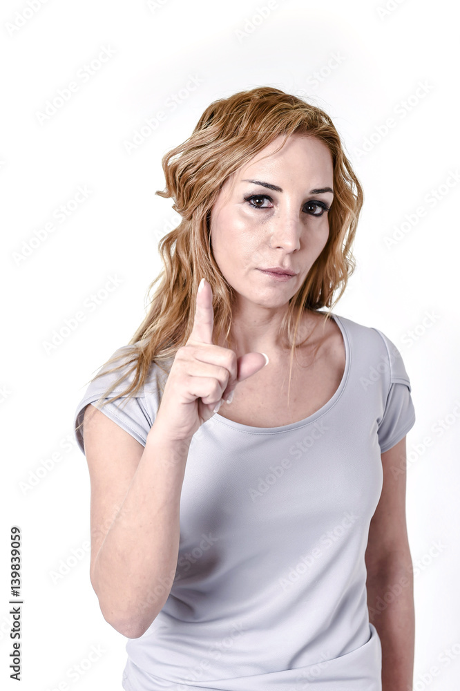 woman staring intense with angry and defiant eyes in disappoint face ...