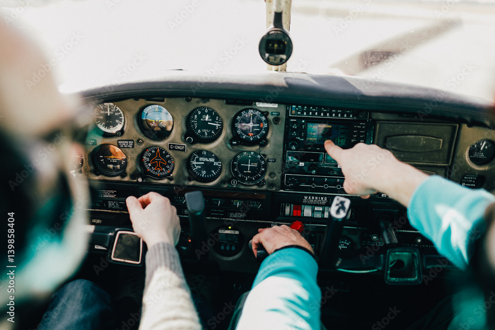 Flight instructor and student inside small Piper aircraft Stock Photo ...