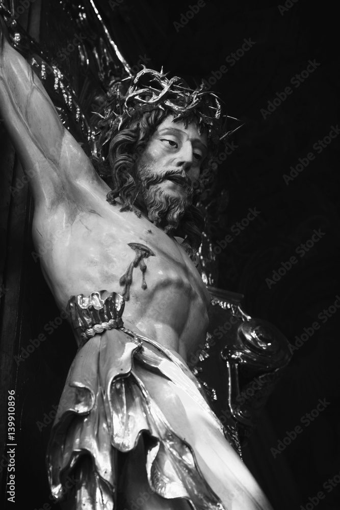 Jesus Christ crucified (an ancient sculpture) Stock Photo | Adobe Stock