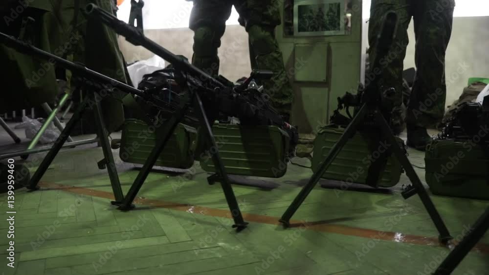 The machine-gun is on the bipods on the floor Stock Video | Adobe Stock