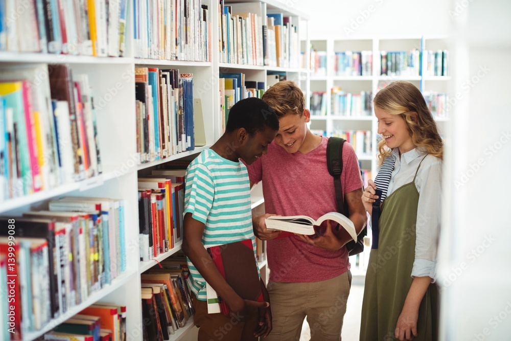 School kids reading books in library at school Stock Photo | Adobe Stock