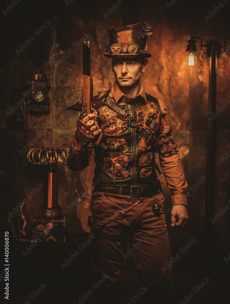 Steampunk man with gun on vintage steampunk background Stock Photo ...