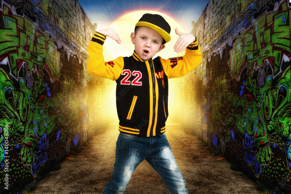 The little boy in the style of Hip-Hop . Children's fashion.Cap and ...