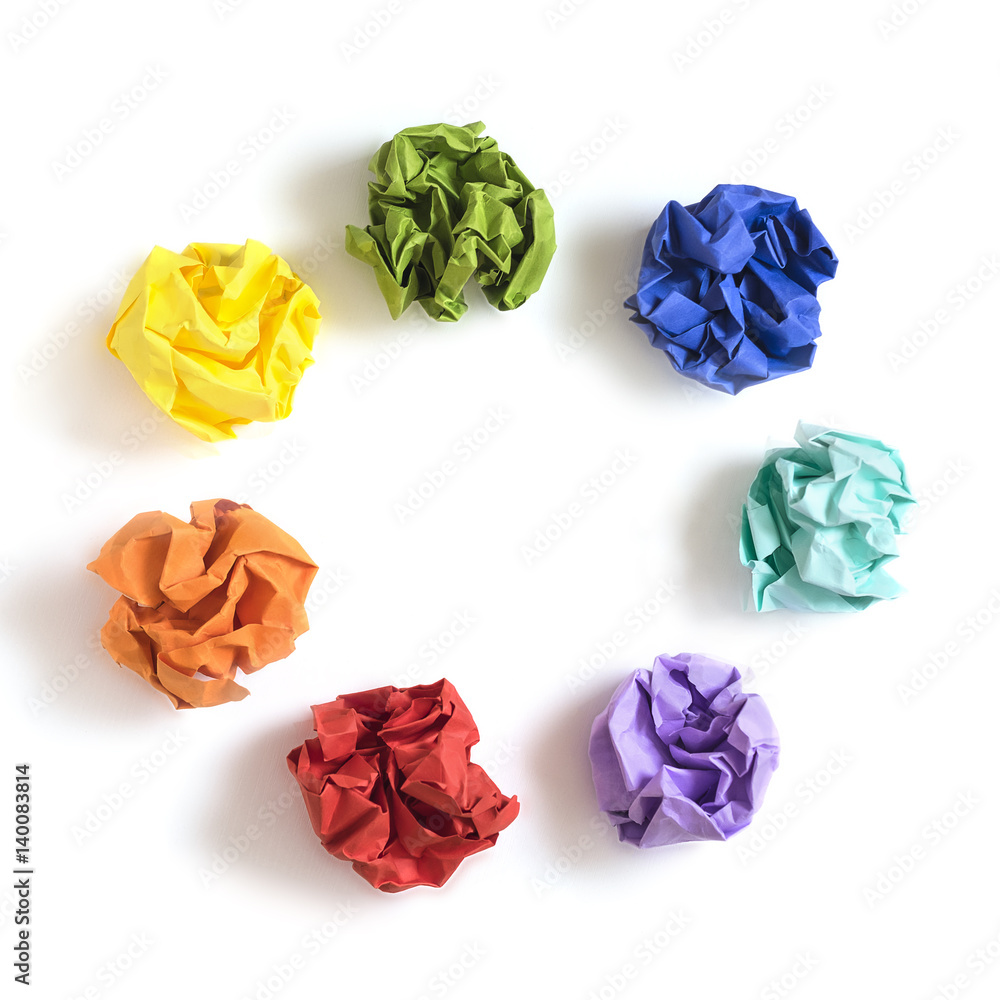 Circle of rainbow colors made by trashed paper balls. Isolated on white ...