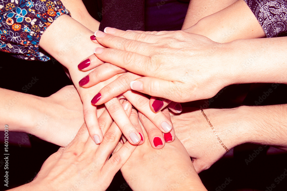 Concept of teamwork: Close-up of hands of colleagues showing unity with ...