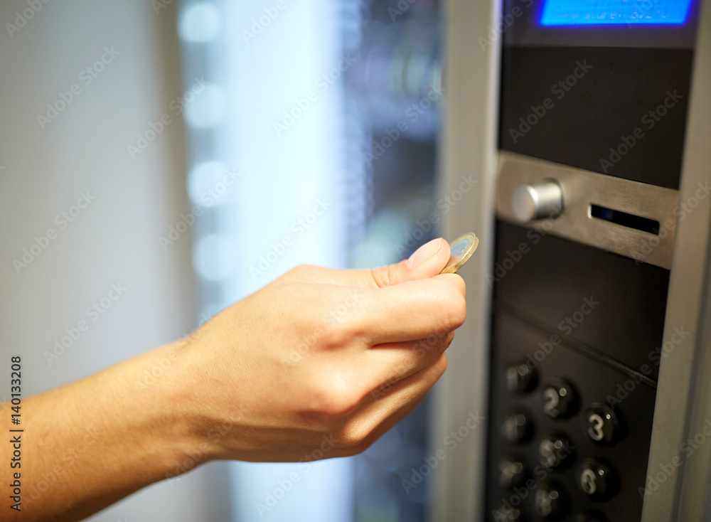 hand inserting euro coin to vending machine Stock Photo | Adobe Stock