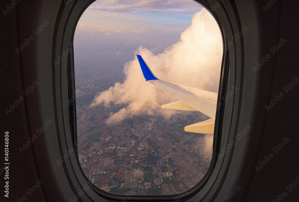 Clouds and sky as seen through window of an aircraft. Looking through ...
