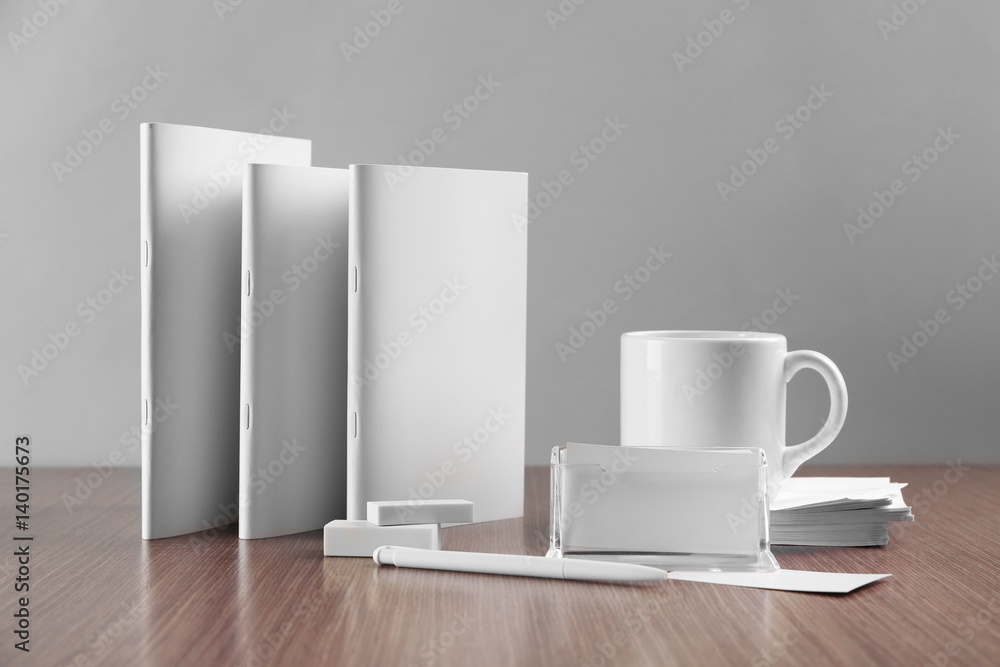 Blank goods on wooden table and grey background Stock Photo | Adobe Stock