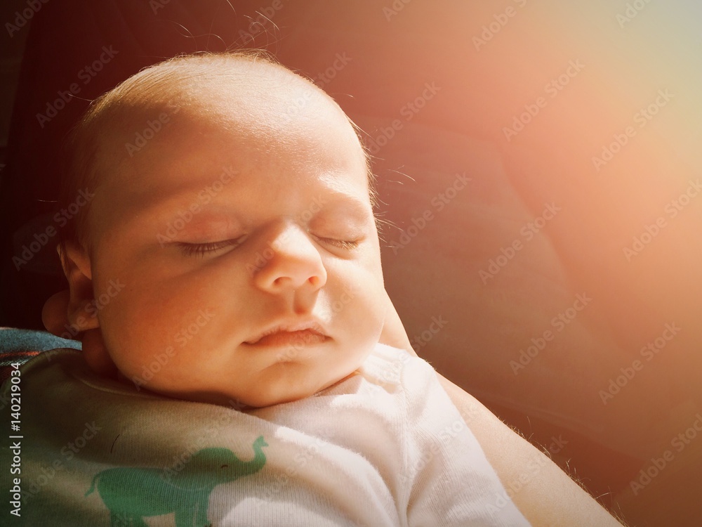 Baby sleeping in sun light. 스톡 사진 | Adobe Stock