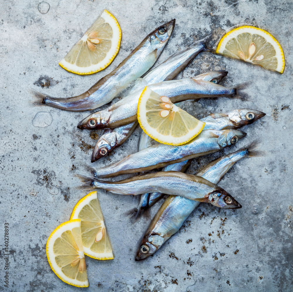 Fresh catch Shishamo fish fully eggs flat lay on shabby metal ...