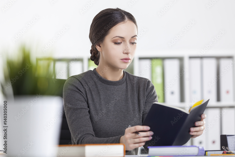 Secretary with a daily planner Stock-Foto | Adobe Stock