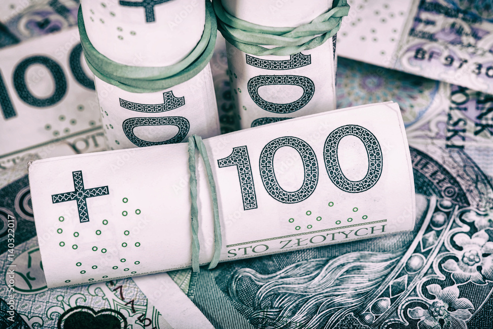 Polish currency PLN, money. File roll of banknotes of 100 PLN (P Stock ...