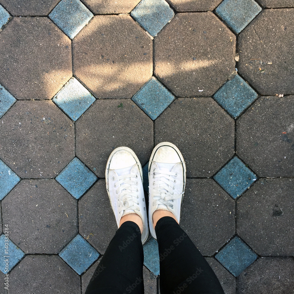 Feet From Above Concept, Teenage Person in White Sneakers Standing on ...