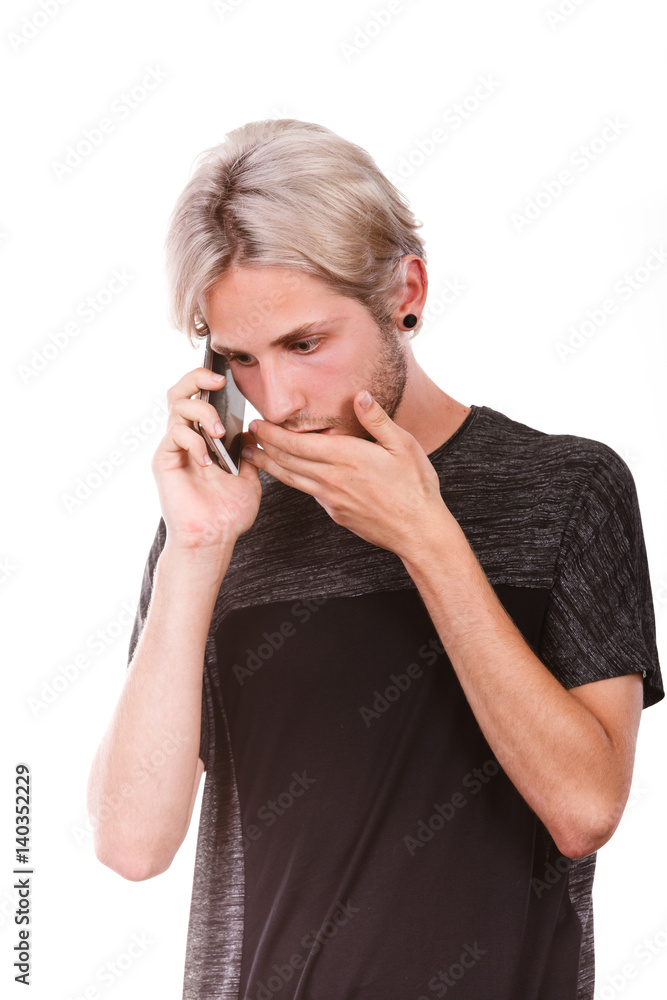 Sad man talking on mobile phone Stock Photo | Adobe Stock
