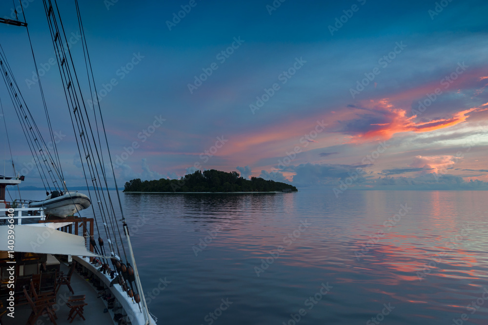 Indonesian Sunset from a Schooner Sailboat. Sailing through the Raja ...