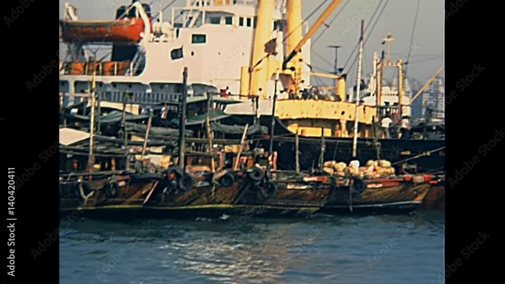 Historic wooden Chinese cargo ships with sailors. Hong Kong port ...