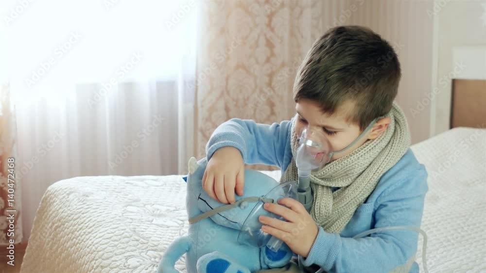 Nebulizer for inhalation, sick child breathes through nebulizer, baby ...