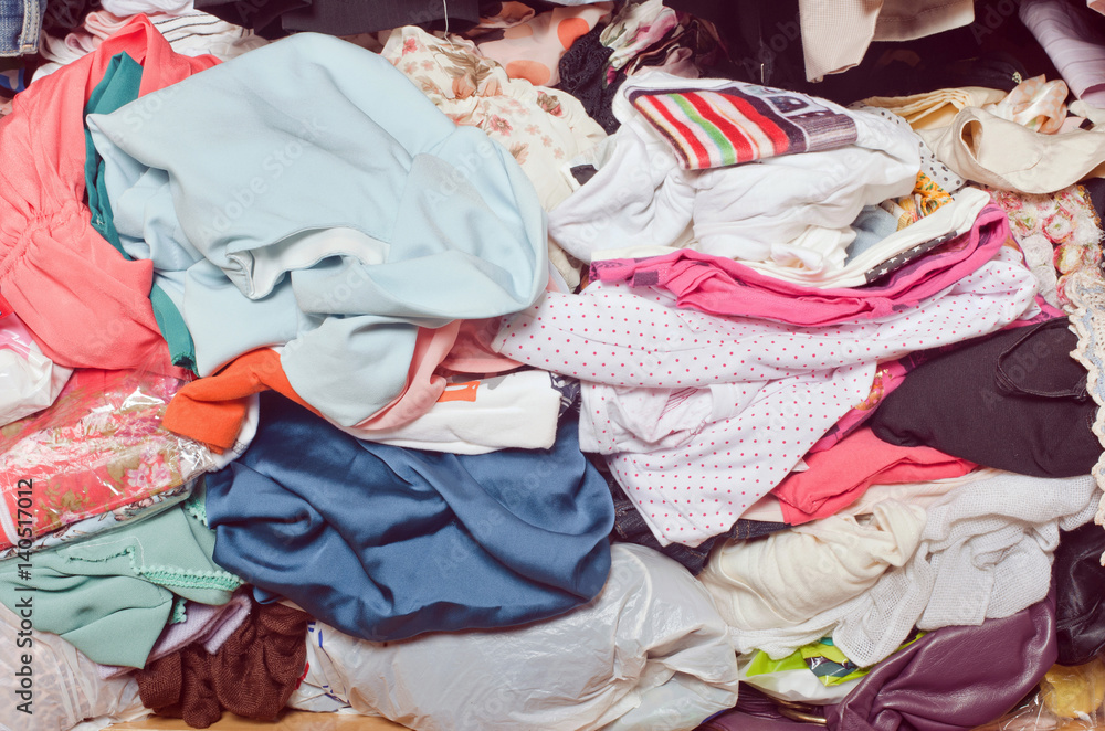 Pile of messy clothes in closet. Untidy cluttered woman. Stock Photo ...