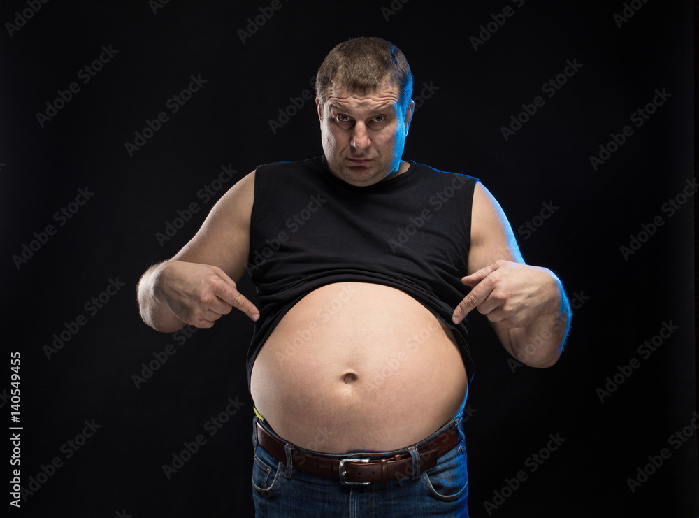 Brutal male actor with a big belly on a black background. Caricature ...
