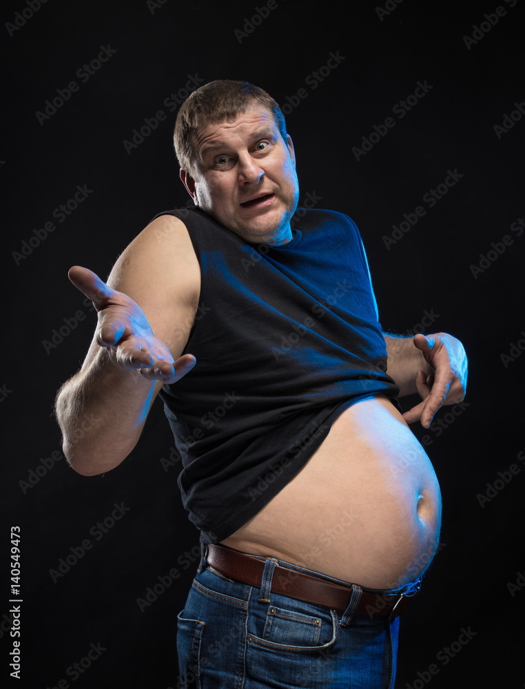 Brutal male actor with a big belly on a black background. Caricature ...