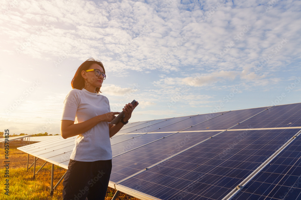 woman engineer working on checking checking status equipment at solar ...