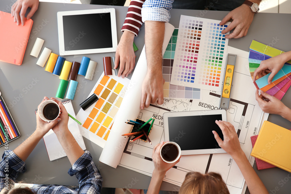 Team of decorators working at table Stock-Foto | Adobe Stock