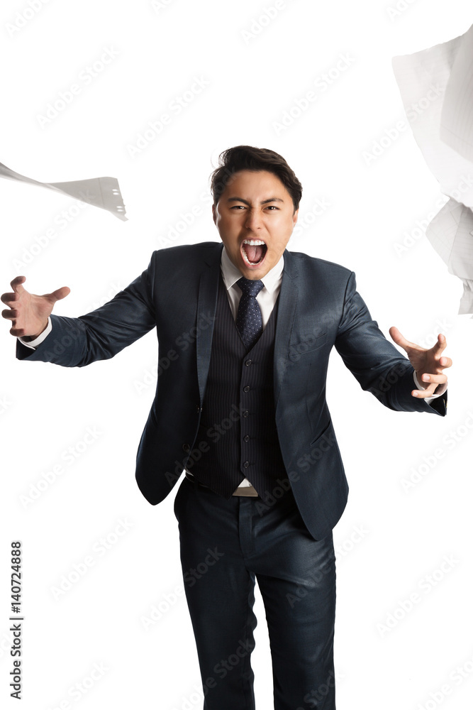 Totally frustrated businessman holding a bunch of paper about to throw ...