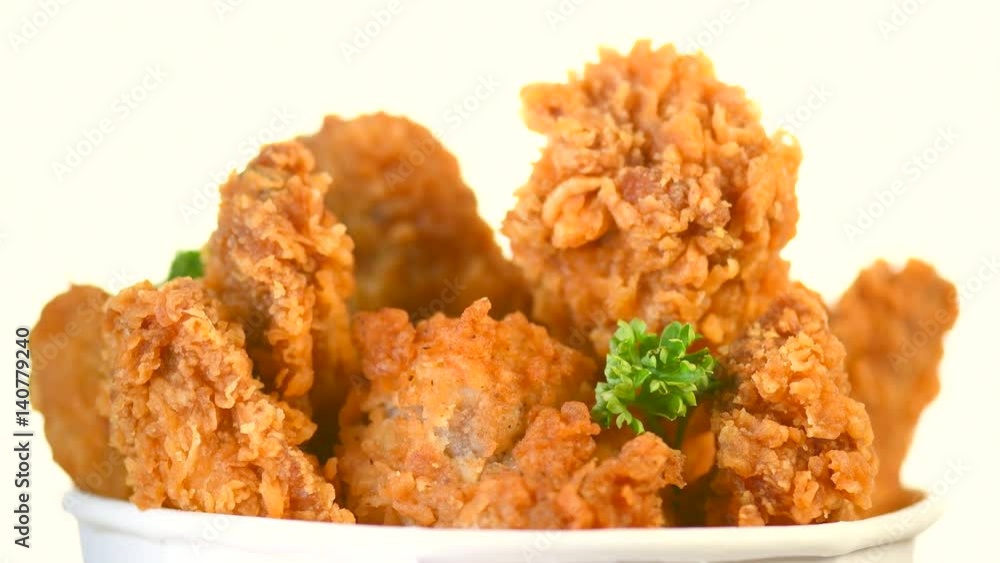 Vidéo Stock Rotation bucket full of crispy fried chicken on white ...