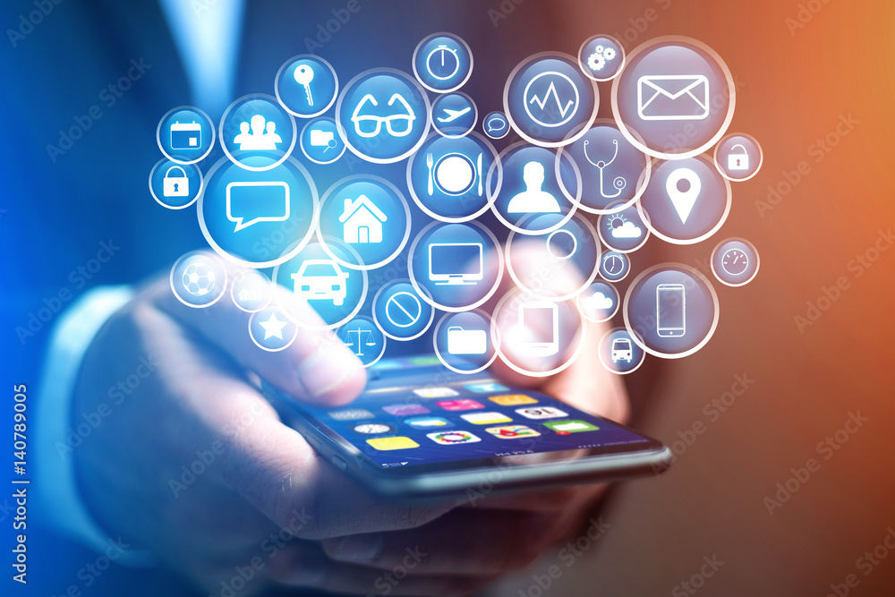 Concept of multimedia icon flying over device on a technology interface ...