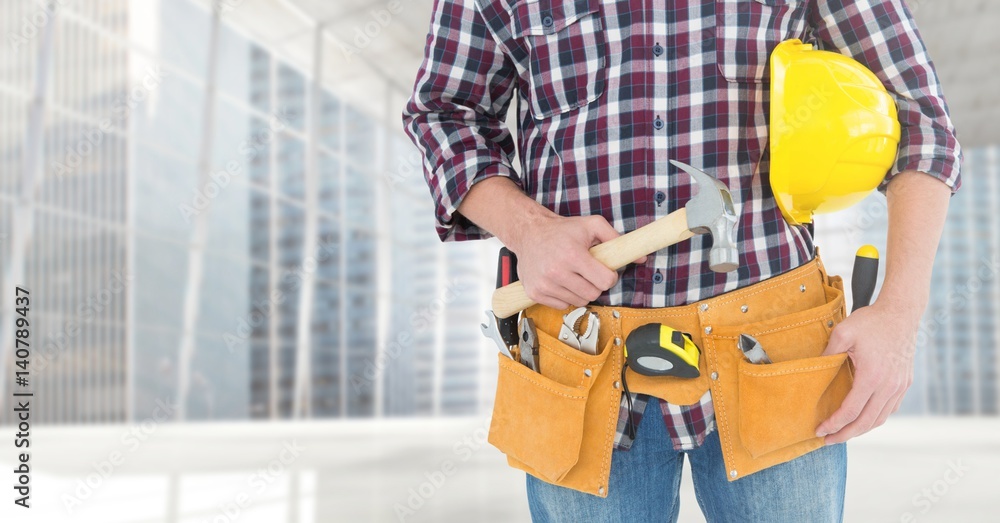 Carpenter with hammer against window Stock-Foto | Adobe Stock