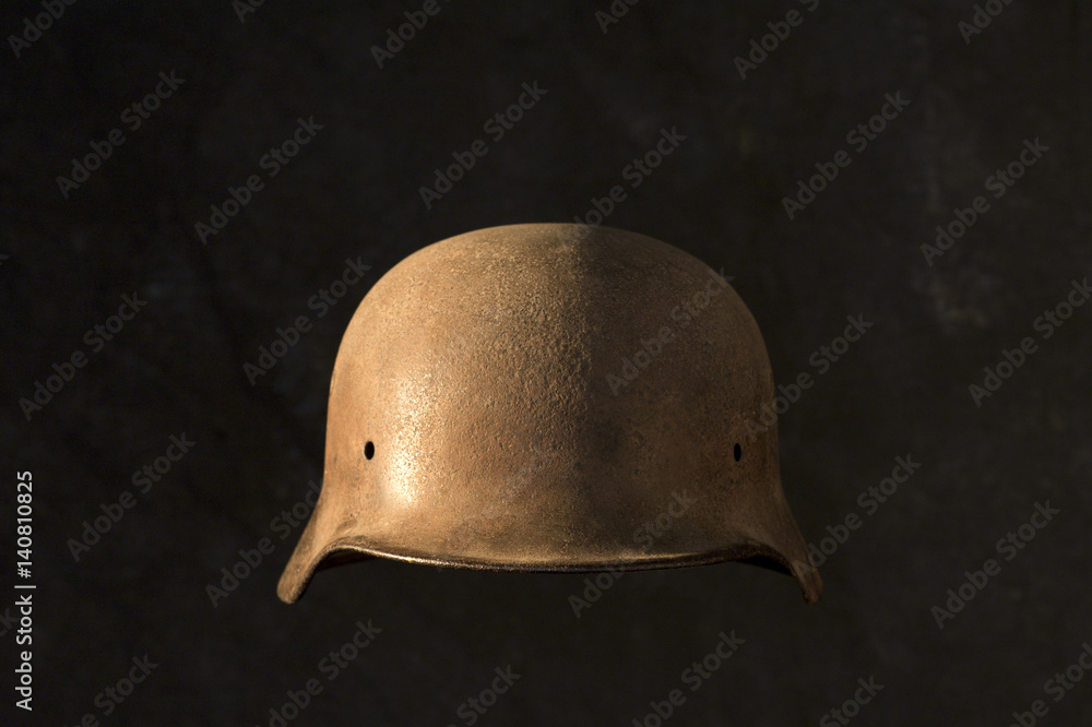 A rusty German World War Two military helmet, on black background Stock ...
