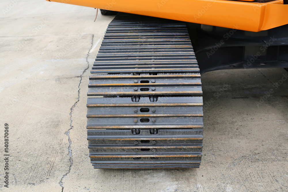 wheel of yellow track-type loader excavator Stock Photo | Adobe Stock