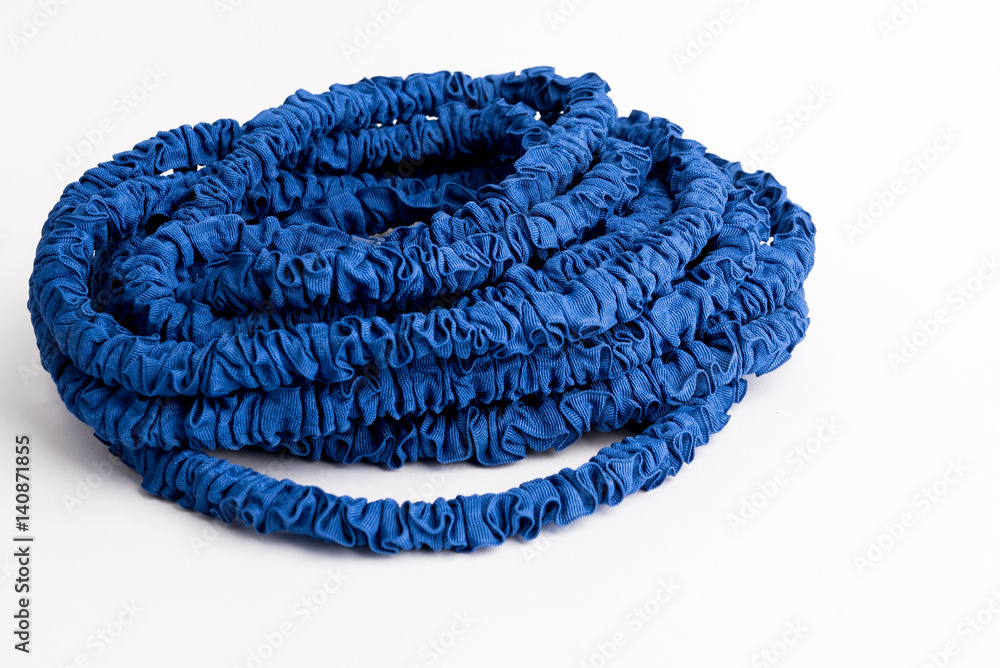 The hose of a garden hose of blue color, made of modern materials, can ...