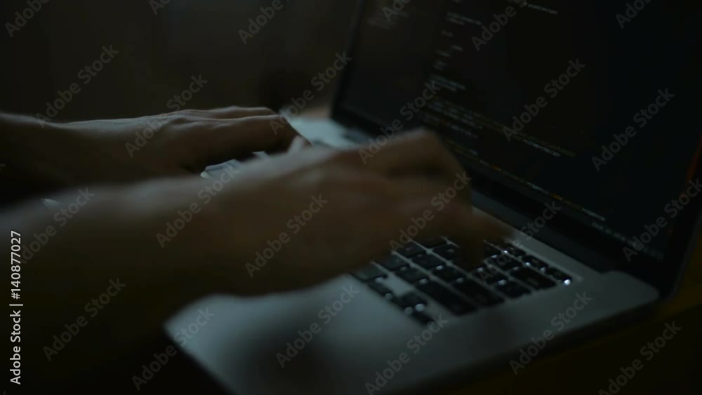 programmer from behind and programming code on computer monitor programming code is my own ...