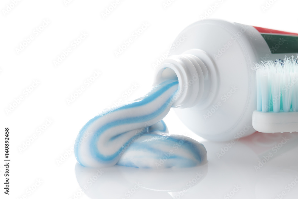 toothpaste and toothbrush on a white background Stock Photo | Adobe Stock