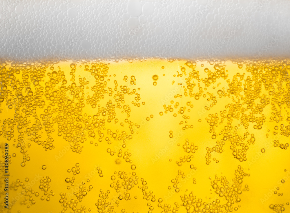 background beer and bubbles with condensation droplets on the outside ...