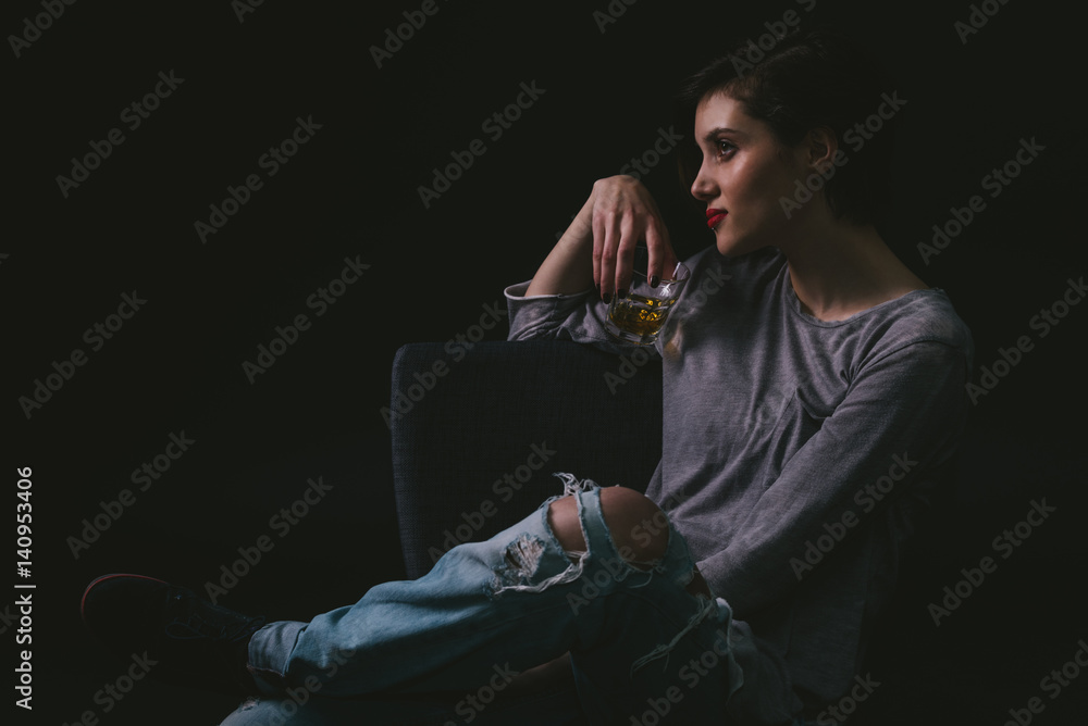 Young girl drinking alone Stock Photo | Adobe Stock