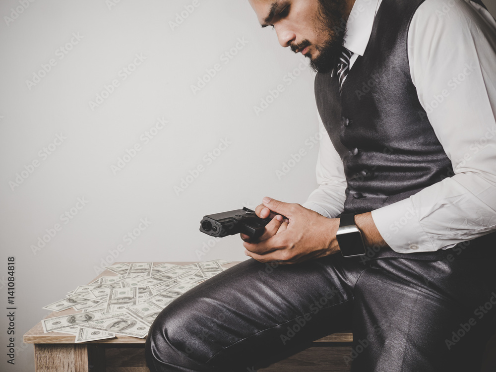 Gangster man hand holding a gun with dollar banknote Stock Photo ...