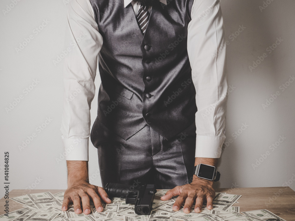 Gangster man hand holding a gun with dollar banknote Stock Photo ...