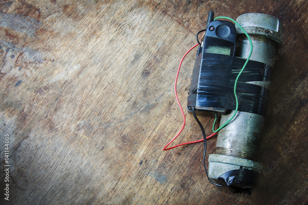 Steel pipe explosive (IED) is ignited by cell phone.For texture and ...