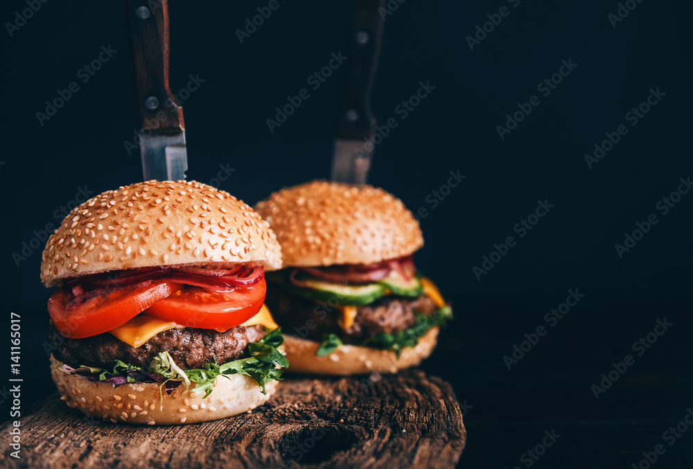 Two mouth-watering, delicious homemade burger used to chop beef. on the ...