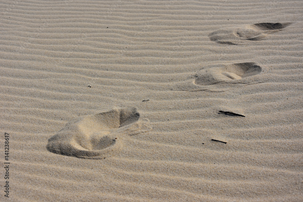 Texture of sand and footprints in the sand on the beach. Summer ...